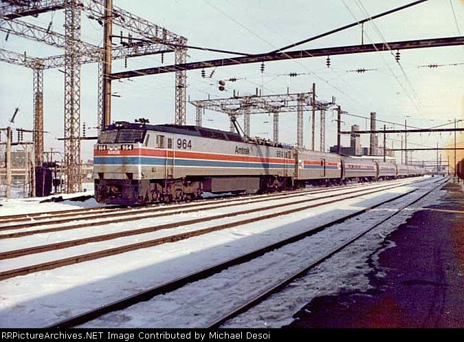 Amtk E-60-CP #964 heads a westbound in the snow at Frankford Junction